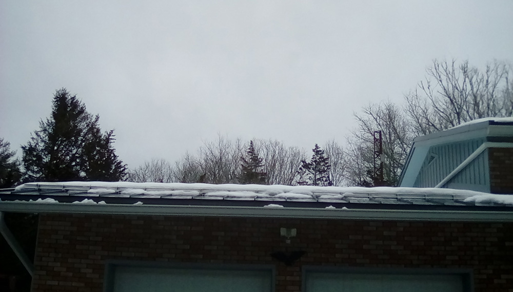 Homeowner chose AceClamp 2-bar snow guards to prevent the snow avalanche